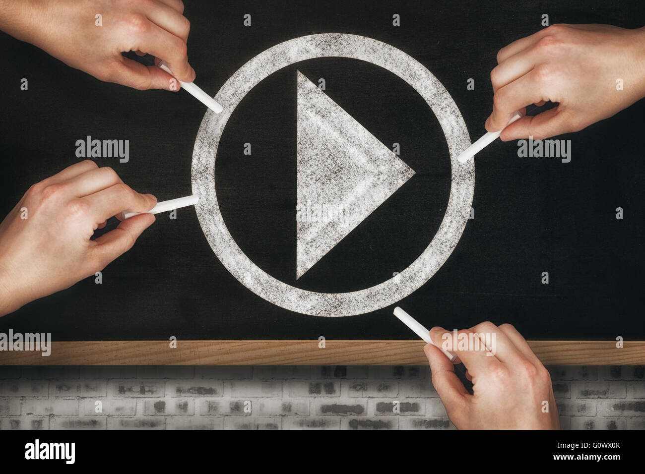 Composite image of multiple hands writing with chalk Stock Photo - Alamy