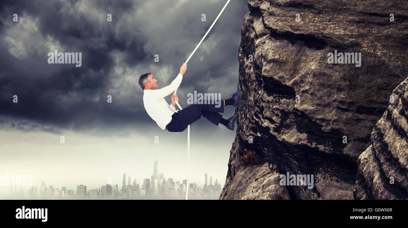 Composite image of businessman pulling rope while sitting on cube Stock ...