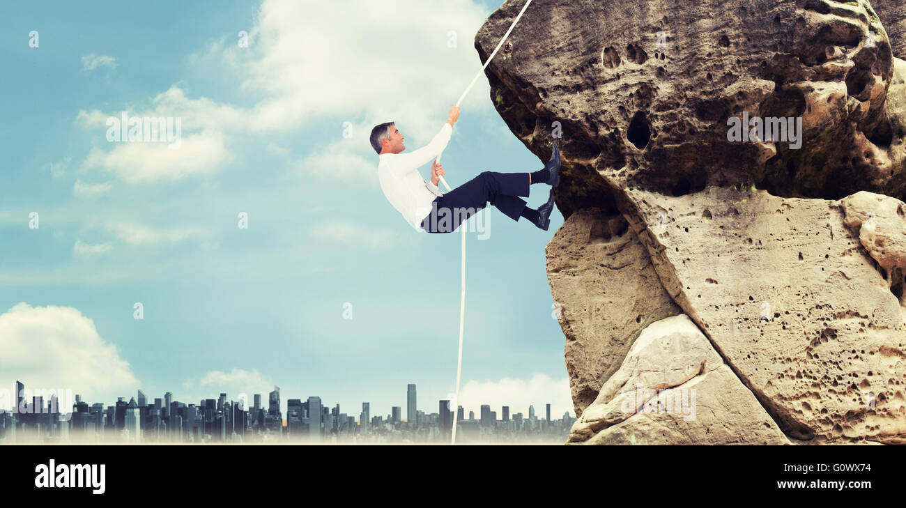 Composite image of businessman pulling rope while sitting on cube Stock ...