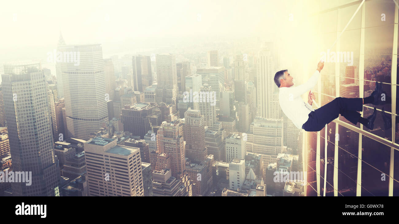 Composite image of businessman pulling rope while sitting on cube Stock ...