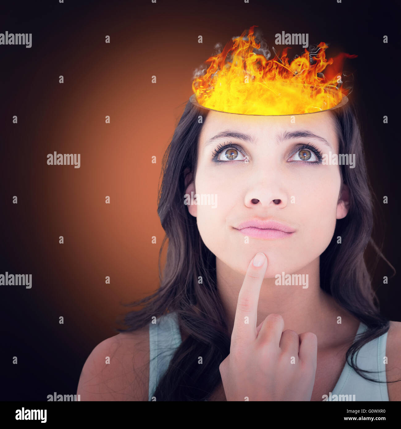 Composite image of pretty brunette looking up thoughfully Stock Photo ...