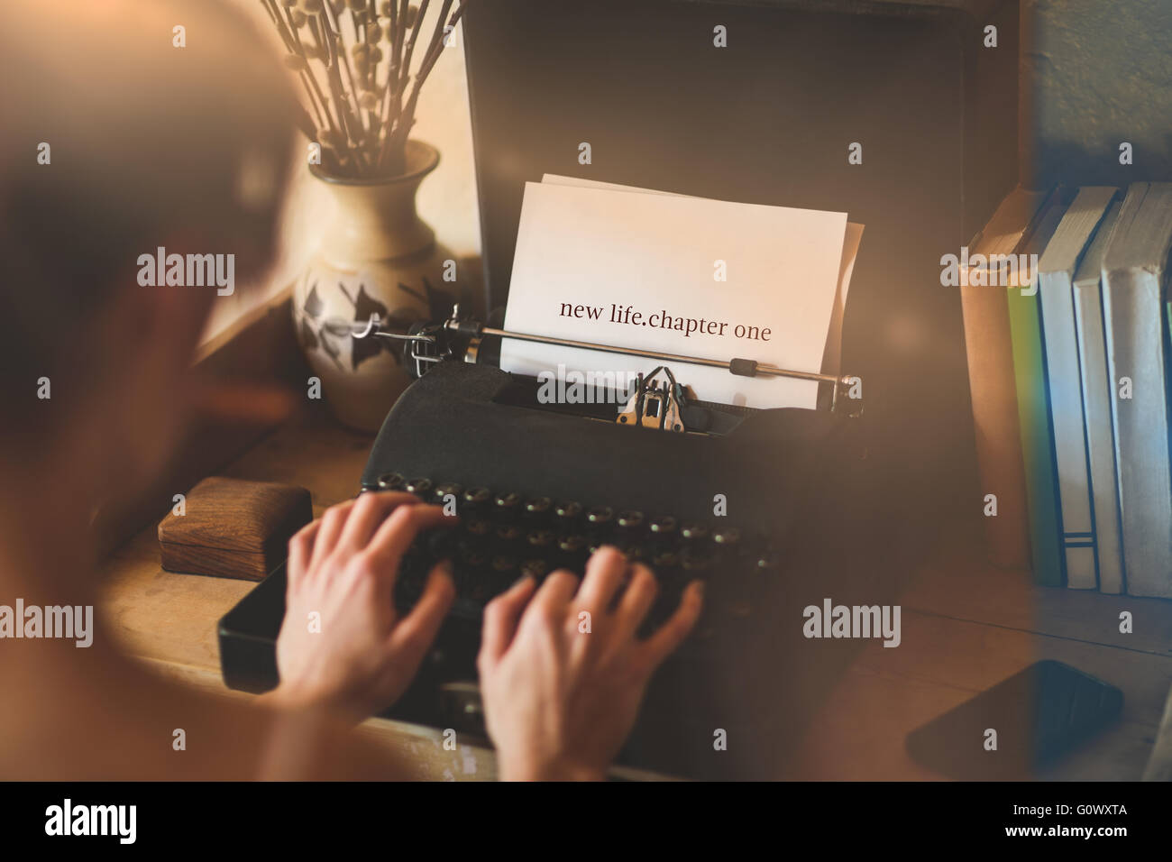 New life chapter one against young woman using typewriter Stock Photo ...
