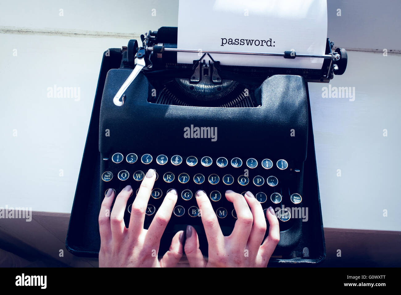 Password: against womans hand typing on typewriter Stock Photo - Alamy