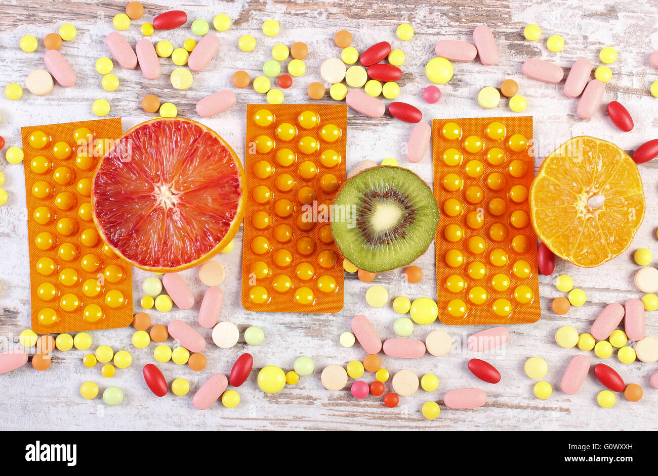 Fresh natural fruits and pills, tablets or capsules, choice between ...
