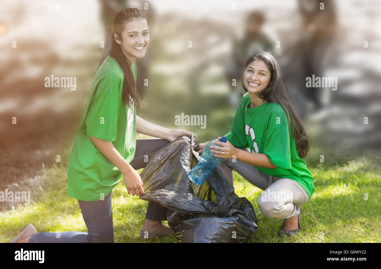 Team of volunteers picking up litter in park Stock Photo - Alamy