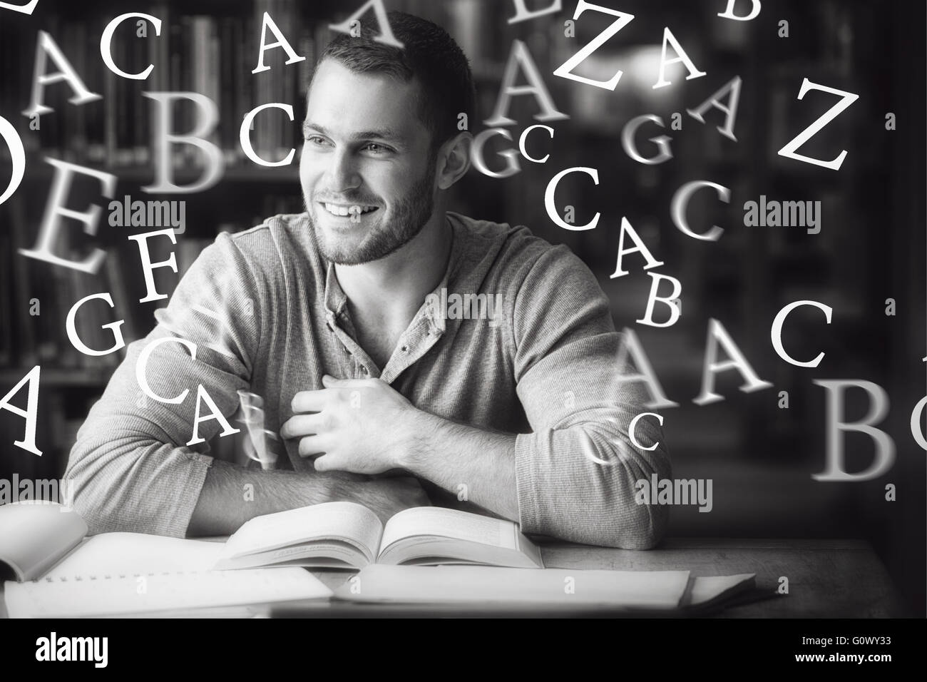 Smiling male student working Stock Photo - Alamy