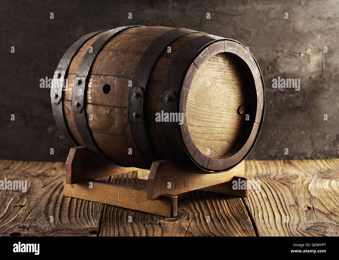 Old wine barrel on wooden table Stock Photo - Alamy