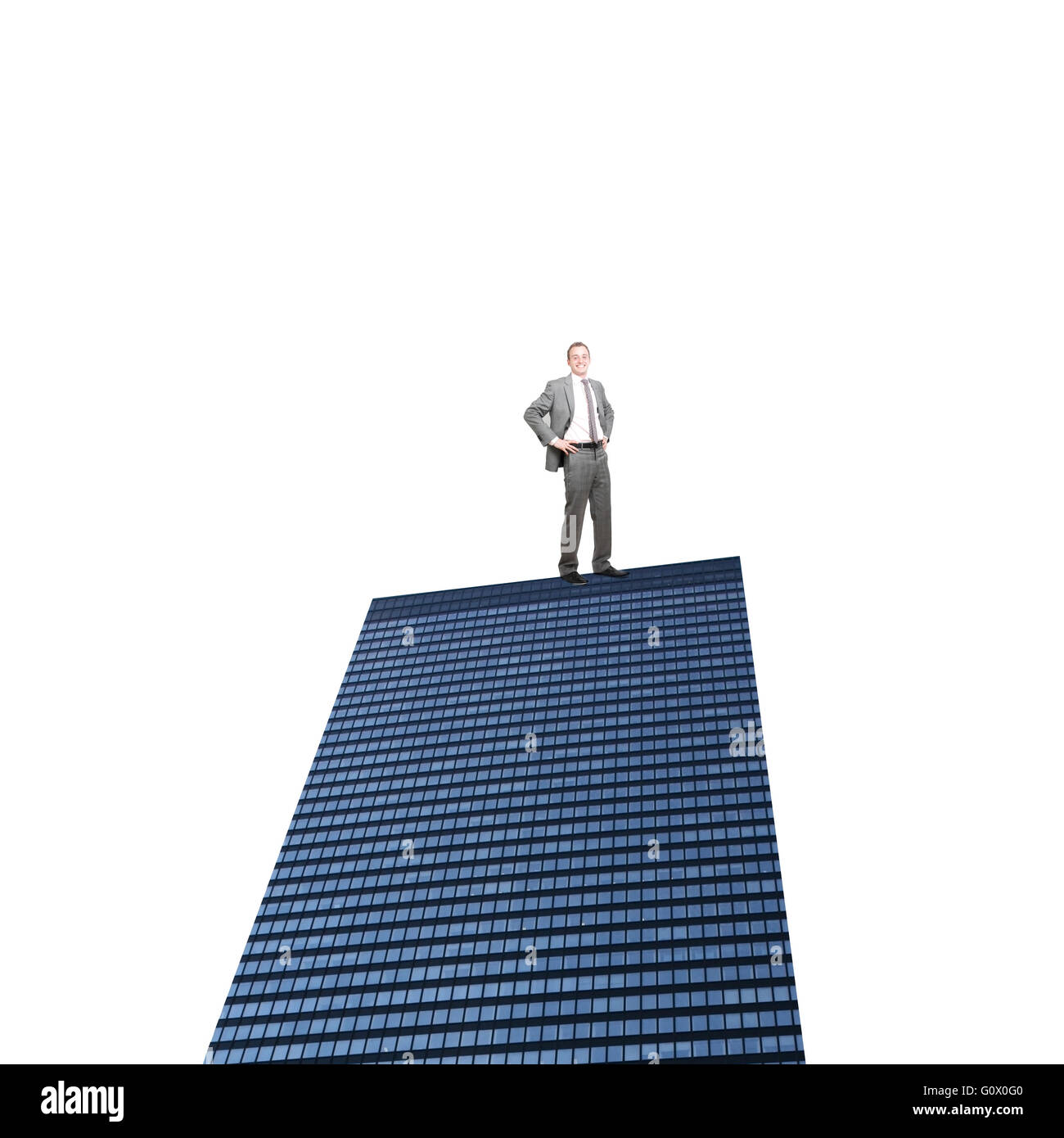 Businessman on building top Stock Photo - Alamy