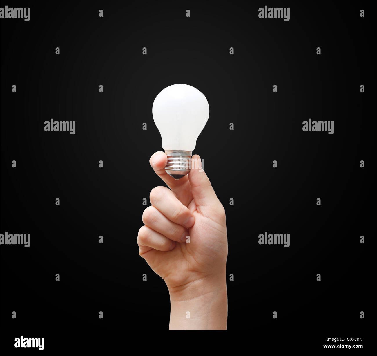 A hand holding a light bulb Stock Photo - Alamy