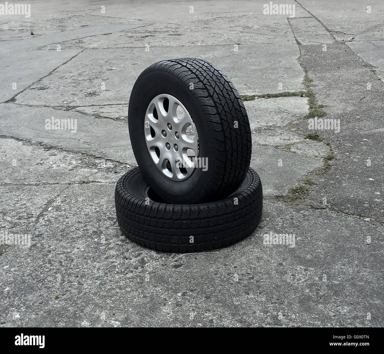 Two tires in a yeard Stock Photo - Alamy