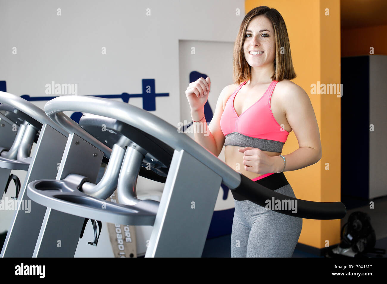 young girl doing legs exercise at gym Stock Photo - Alamy