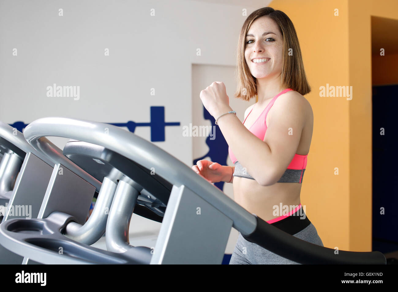 young girl doing legs exercise at gym Stock Photo - Alamy