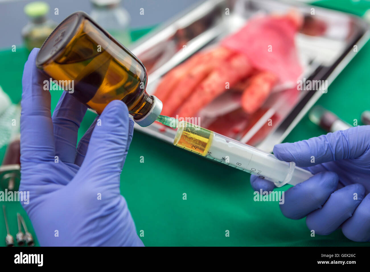 Doctor holding syringe medication hi-res stock photography and images ...