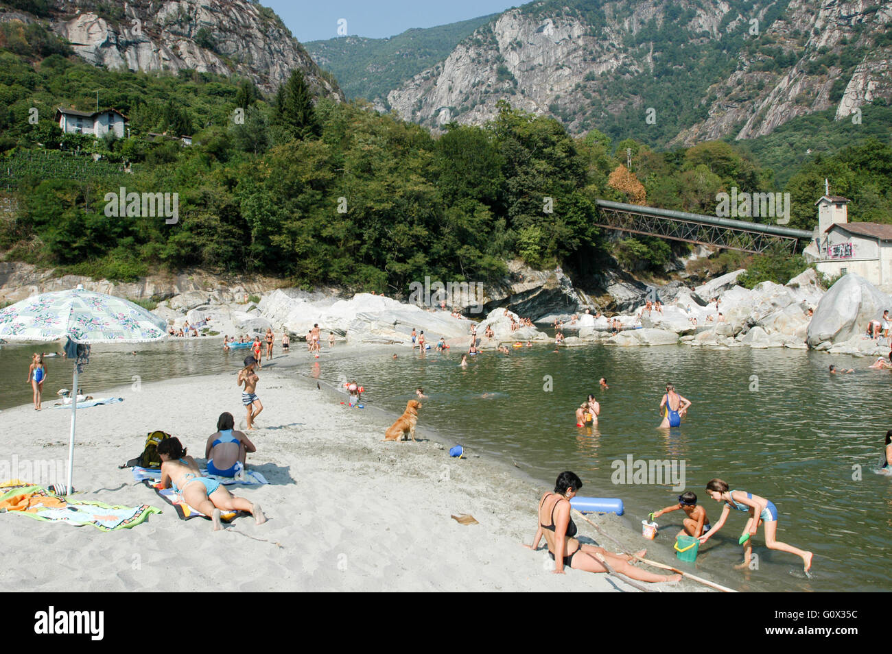 Ponte Brolla, Switzerland - 12 August 2002: People swimming and ...