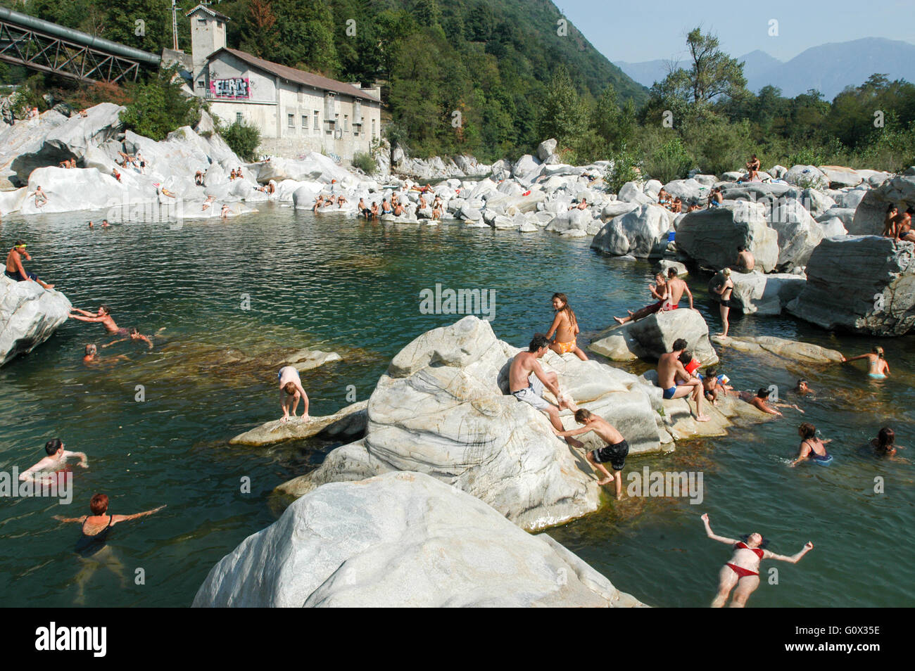 Ponte Brolla, Switzerland - 12 August 2002: People swimming and ...