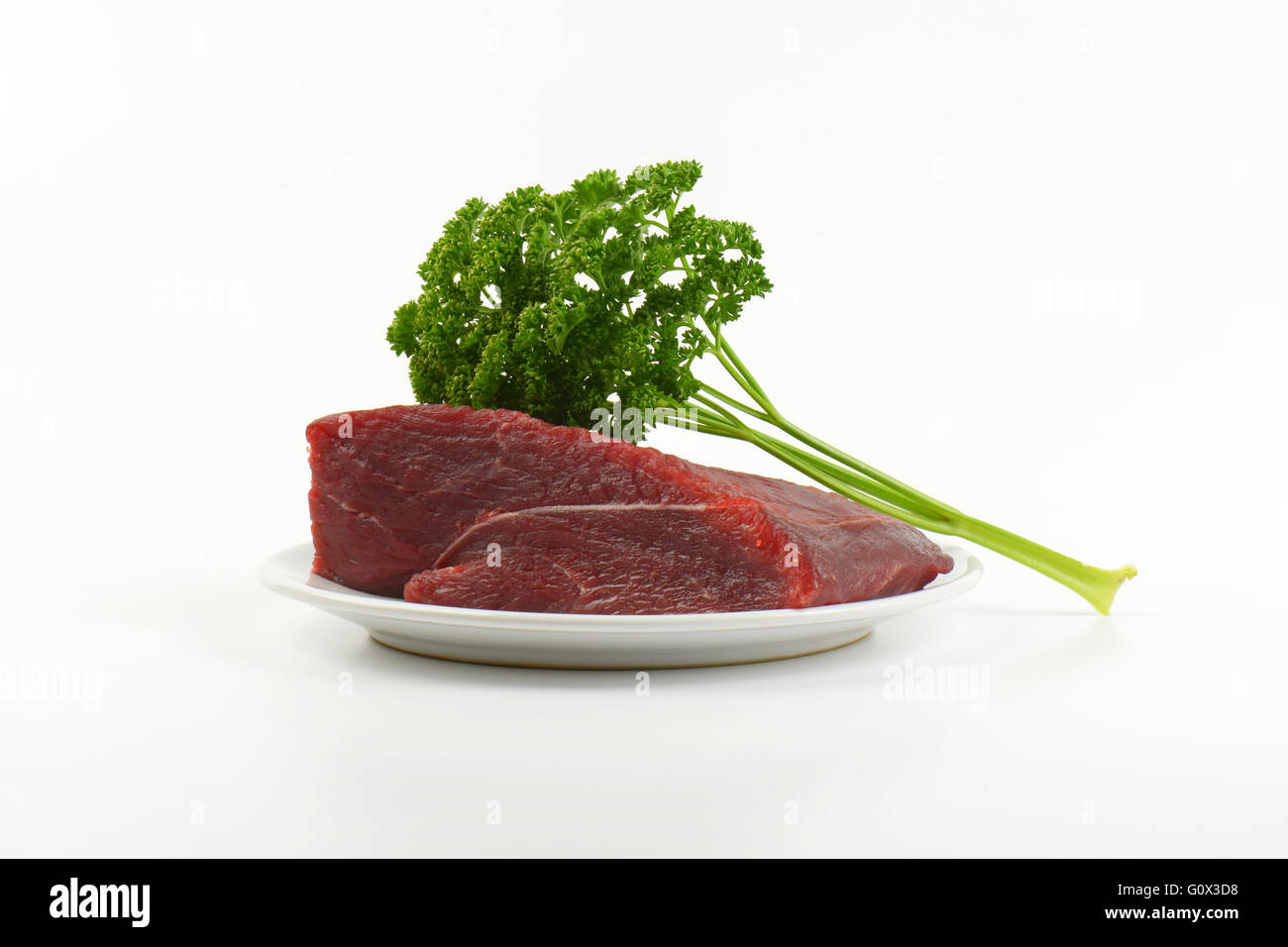 Piece raw meat parsley hi-res stock photography and images - Alamy