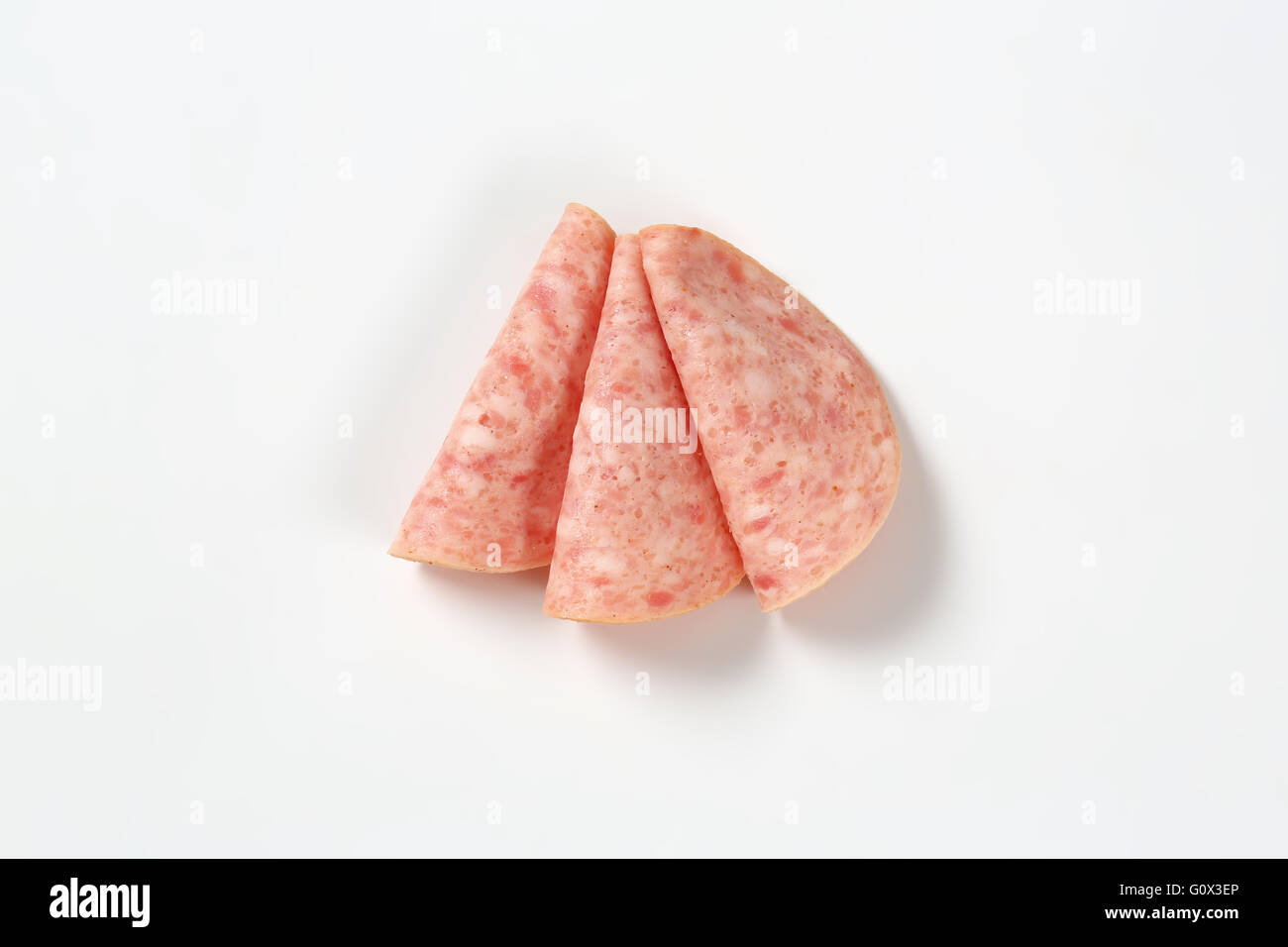 slices of ham salami arranged on white background Stock Photo - Alamy