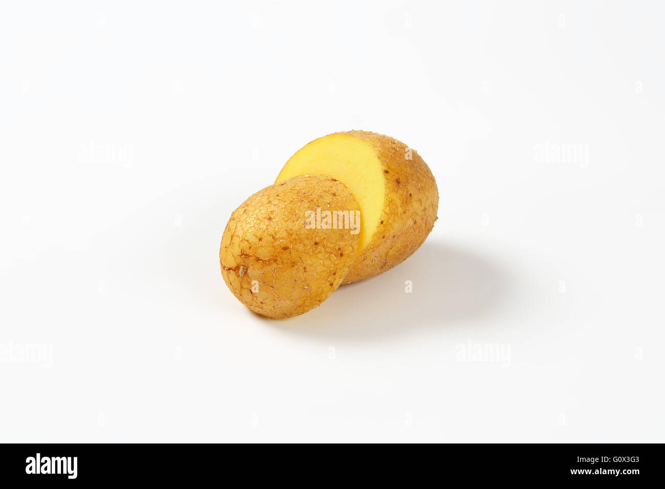 halved raw potato on white background Stock Photo - Alamy