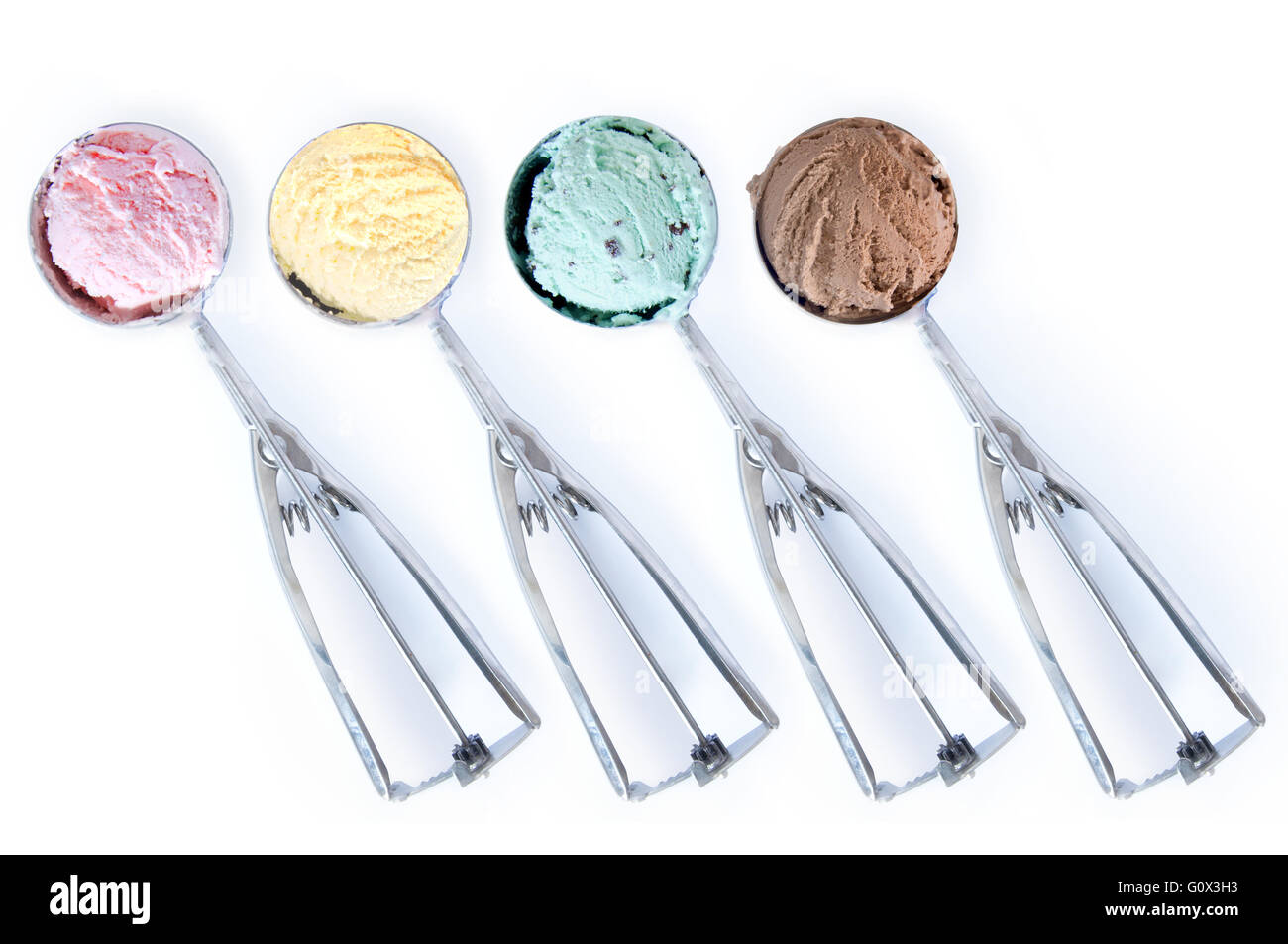 Four flavored ice cream scoops over a white background Stock Photo - Alamy