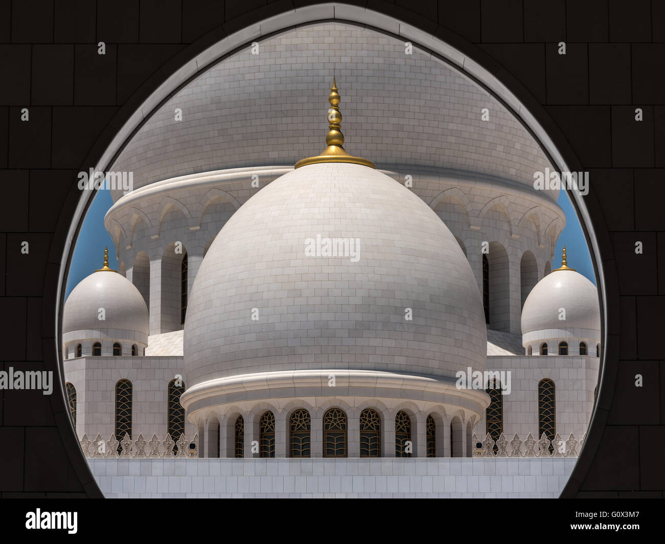 Dome of Sheikh Zayed Grand Mosque in Abu Dhabi, seen through an arch ...