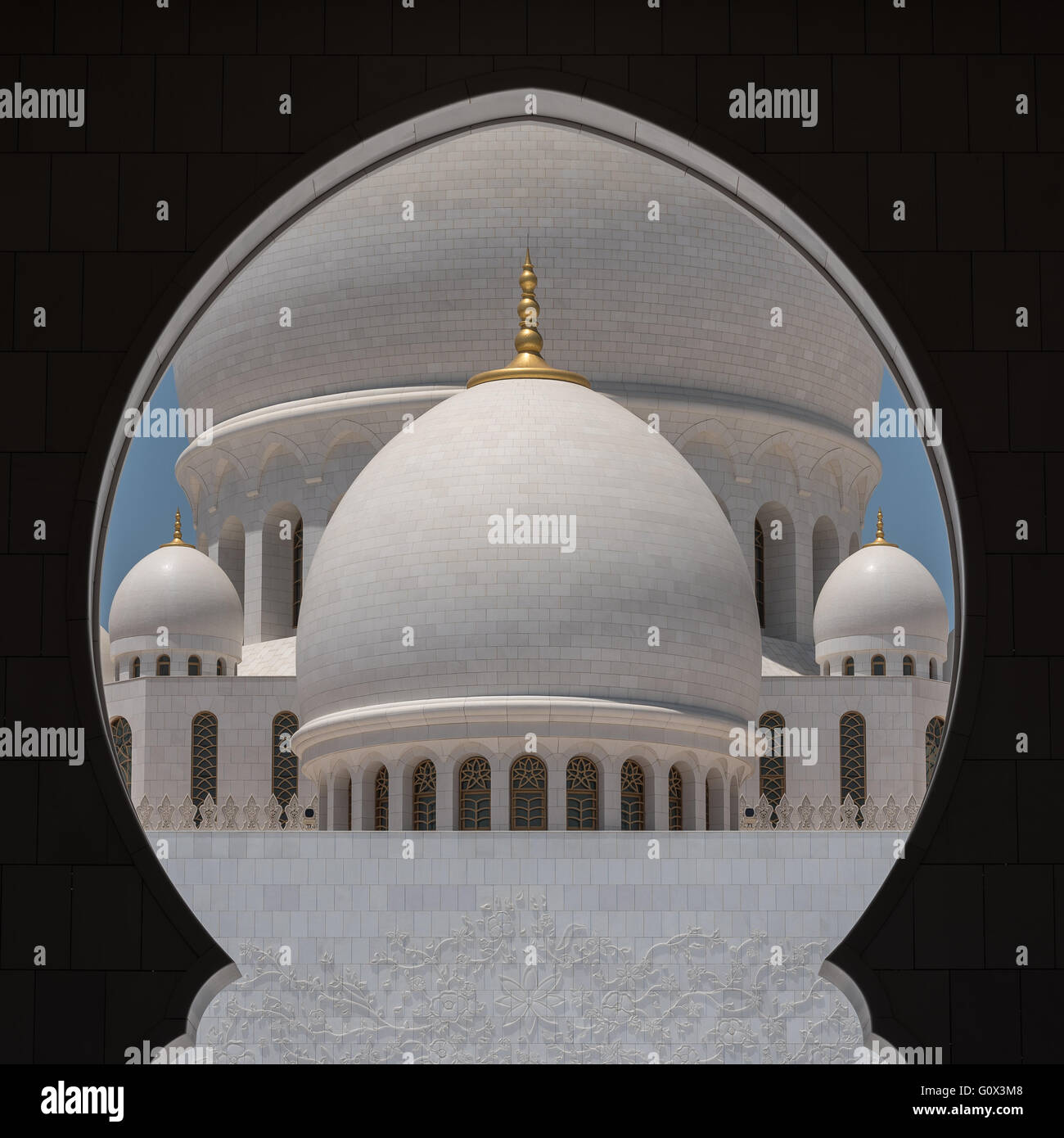 Dome of Sheikh Zayed Grand Mosque in Abu Dhabi, seen through an arch ...