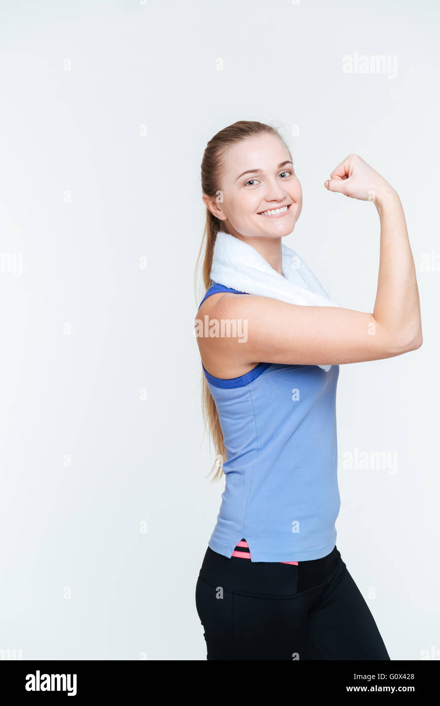 Cute girl showing biceps hi-res stock photography and images - Alamy