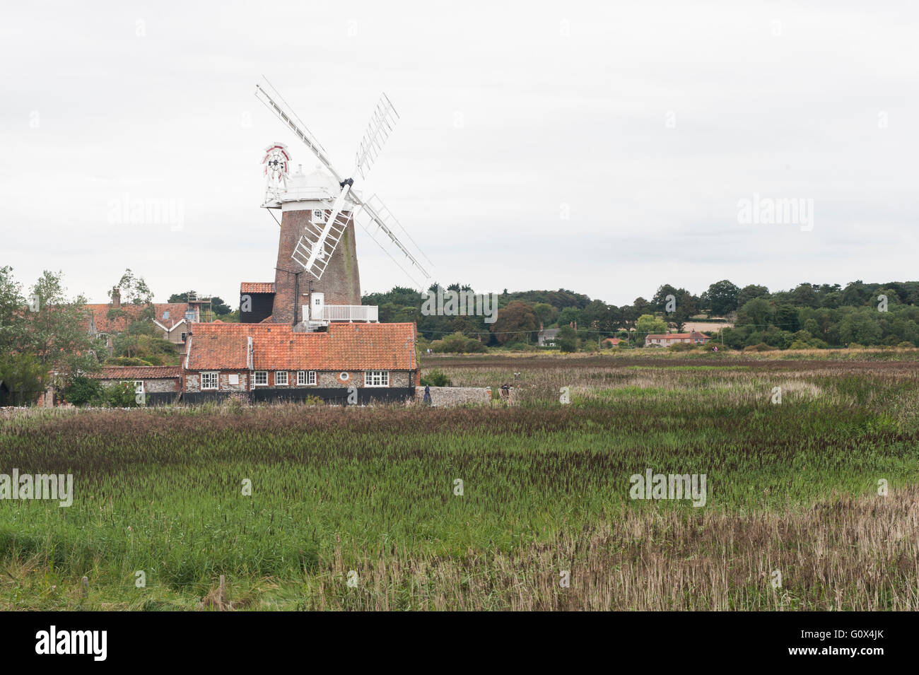 The Windmill B&B at Cley-next-the-sea stands tall in a salt-marsh ...