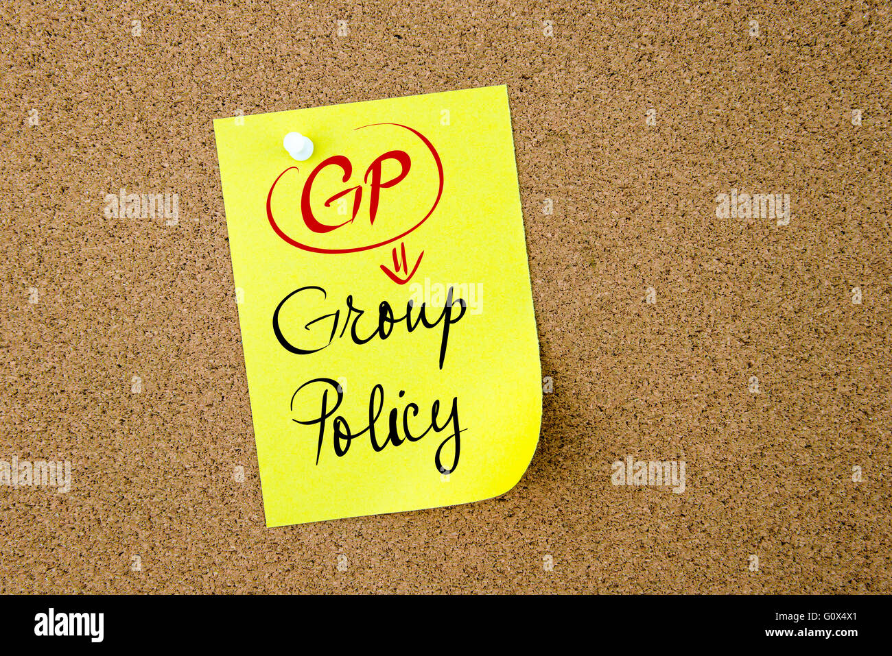 Business Acronym GP Group Policy written on yellow paper note pinned on ...