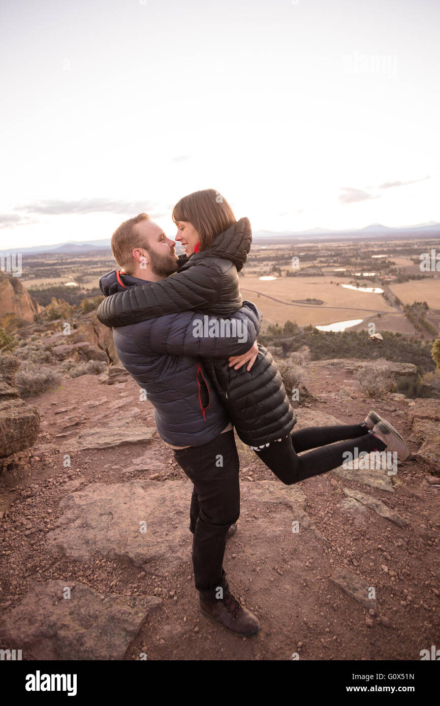 Lifestyle portrait of an engaged couple that loves the outdoors at ...