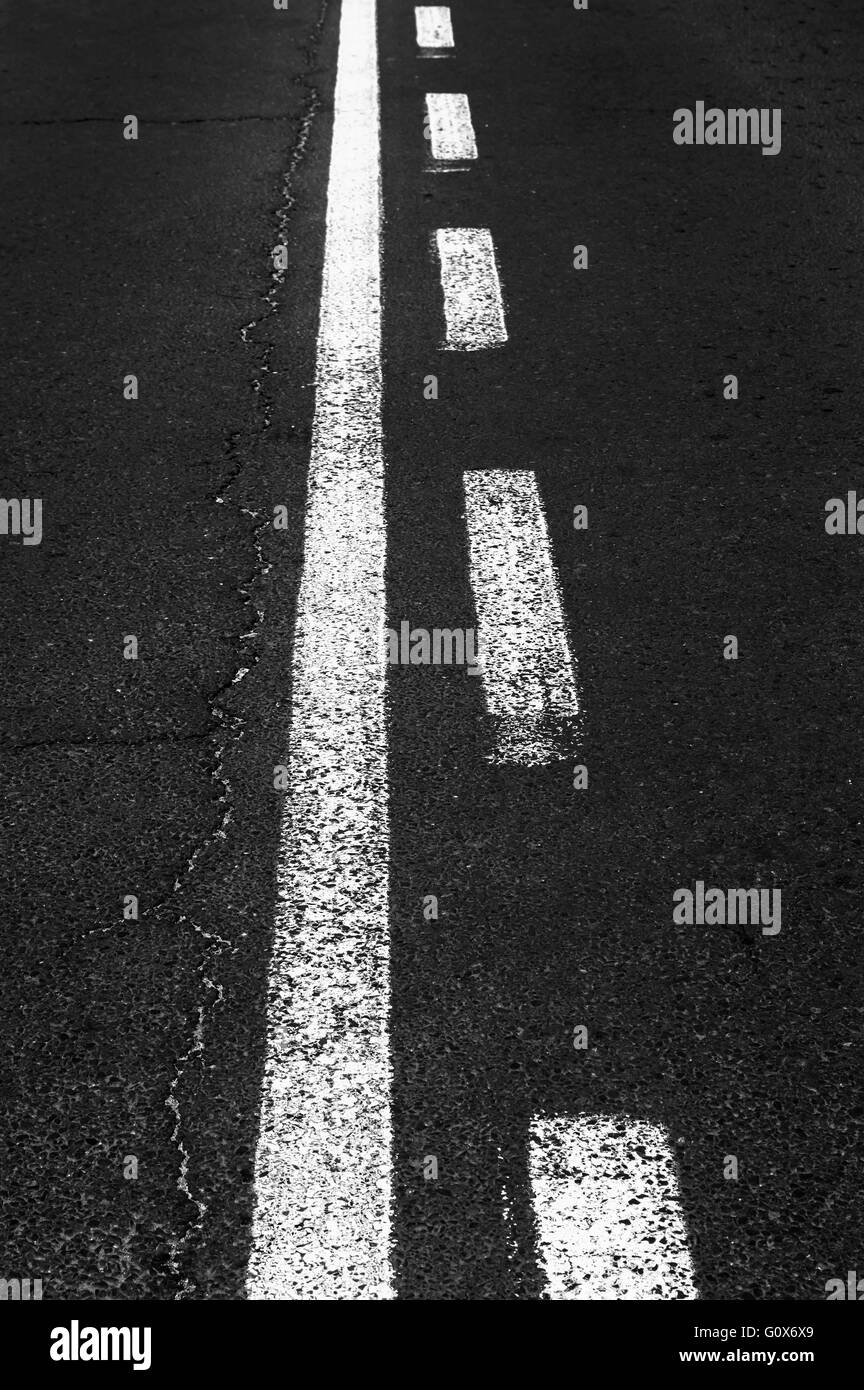 Double white grunge line on asphalt road Stock Photo - Alamy