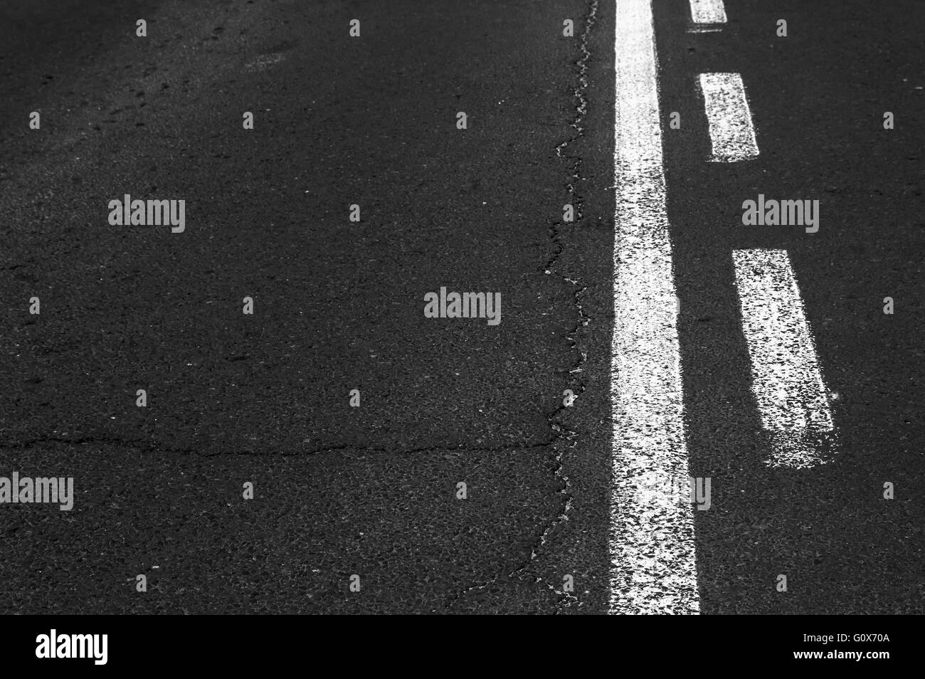 Double white grunge line on asphalt road Stock Photo - Alamy