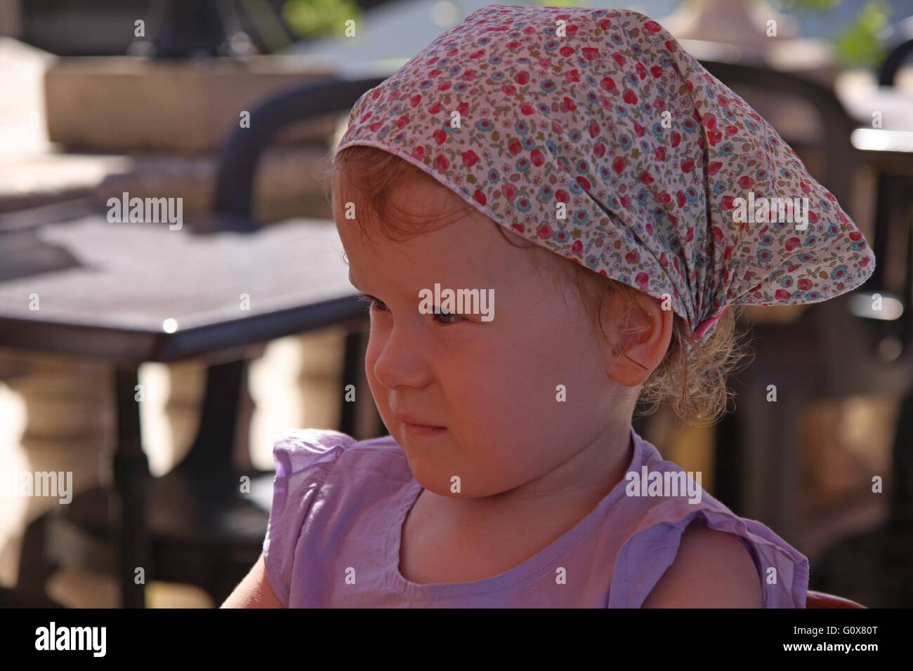 Cute little girl at the restaurant, Malta Stock Photo - Alamy