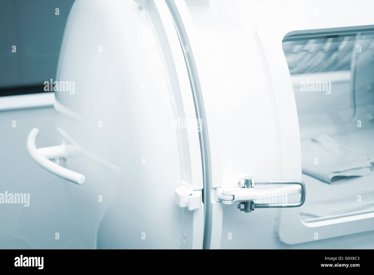 Hyperbaric oxygen therapy HBOT chamber tank in medical hospital clinic ...