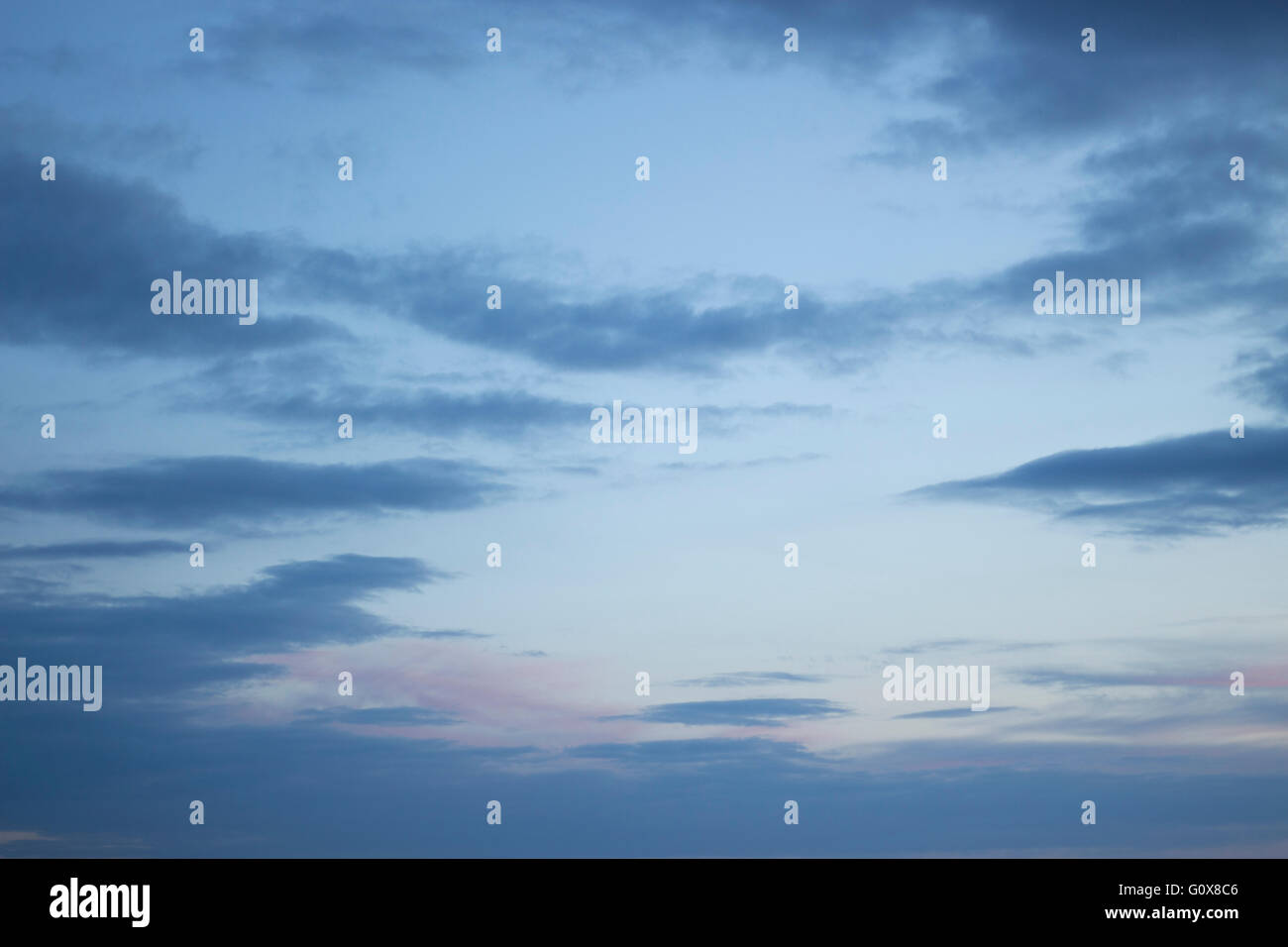 Sunset blue sky with clouds color photo Stock Photo - Alamy