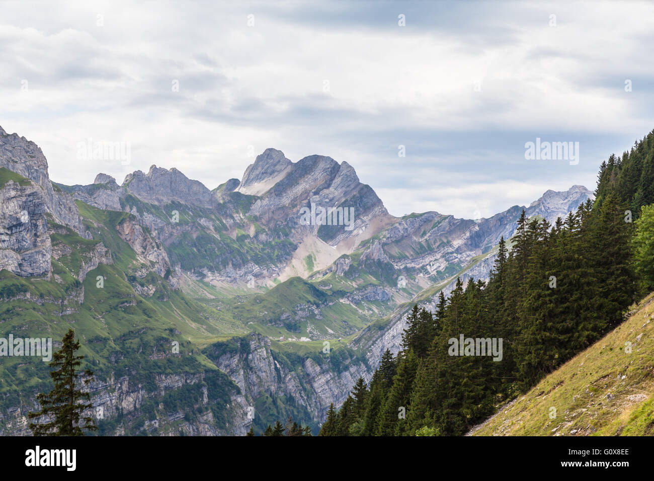 View of Meglisalp and Altmann of Alpstein massif on a clouudy day in ...