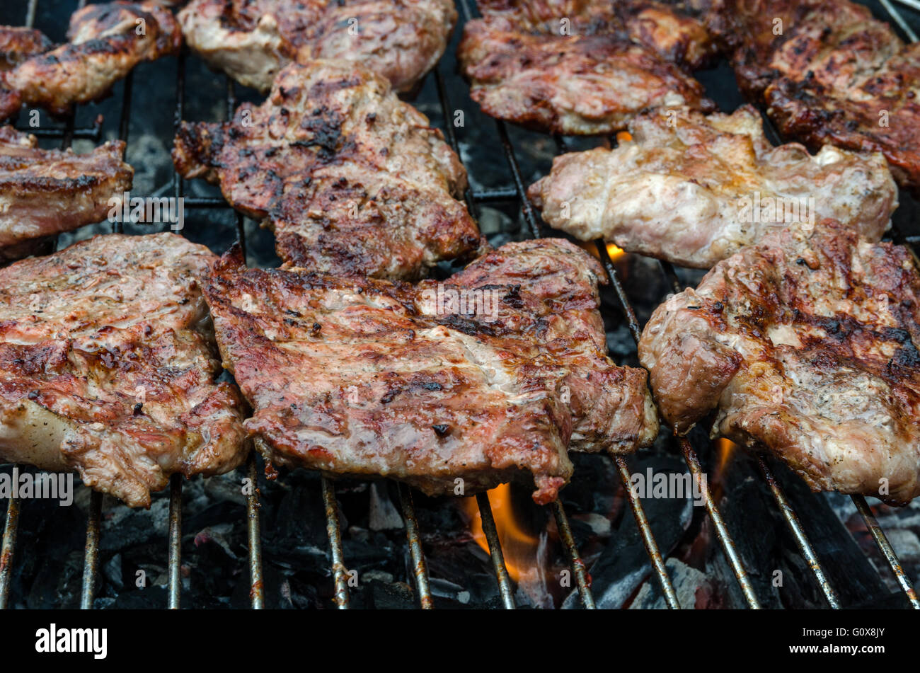 Pork meat on the grill Stock Photo - Alamy