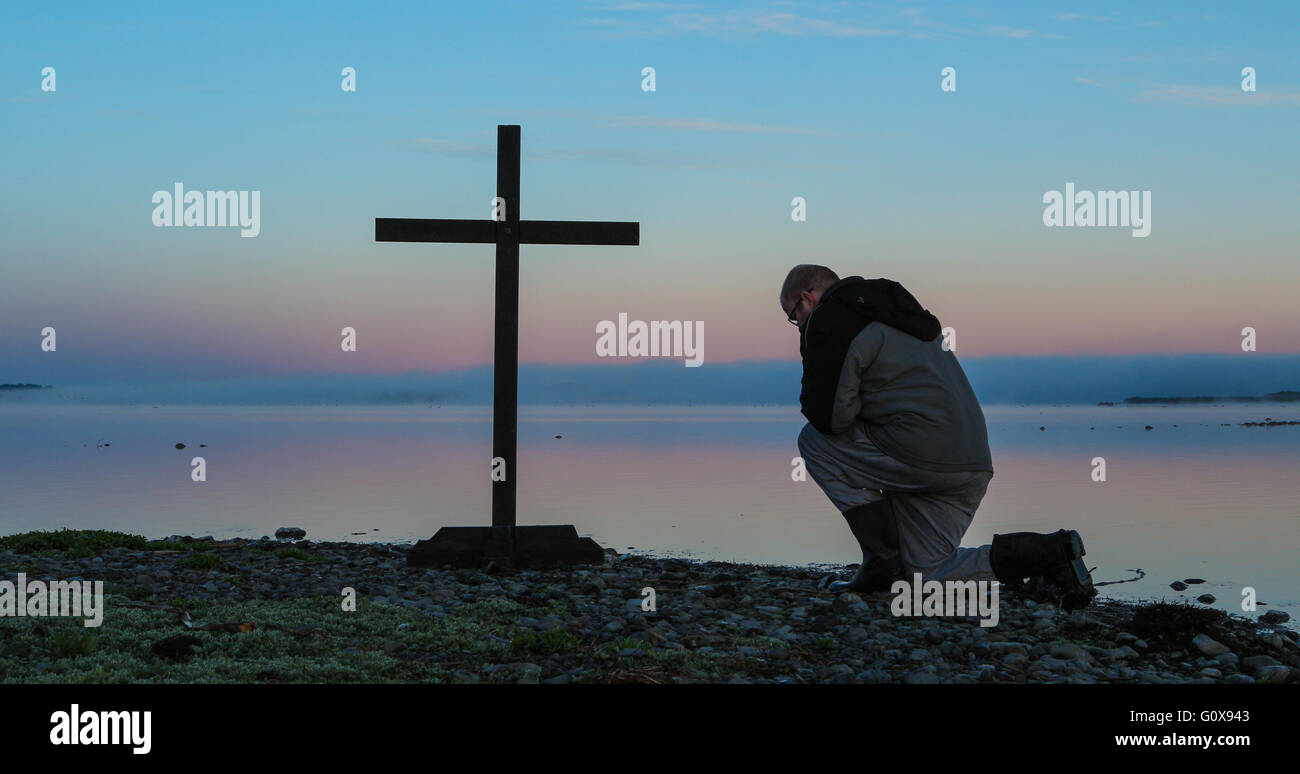 Person Kneeling In Prayer Front View