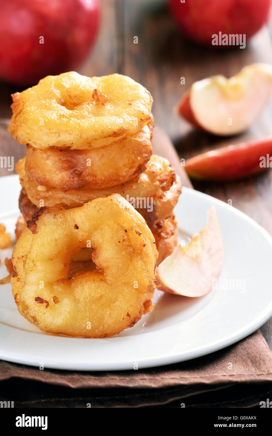 Apple rings on white plate Stock Photo - Alamy
