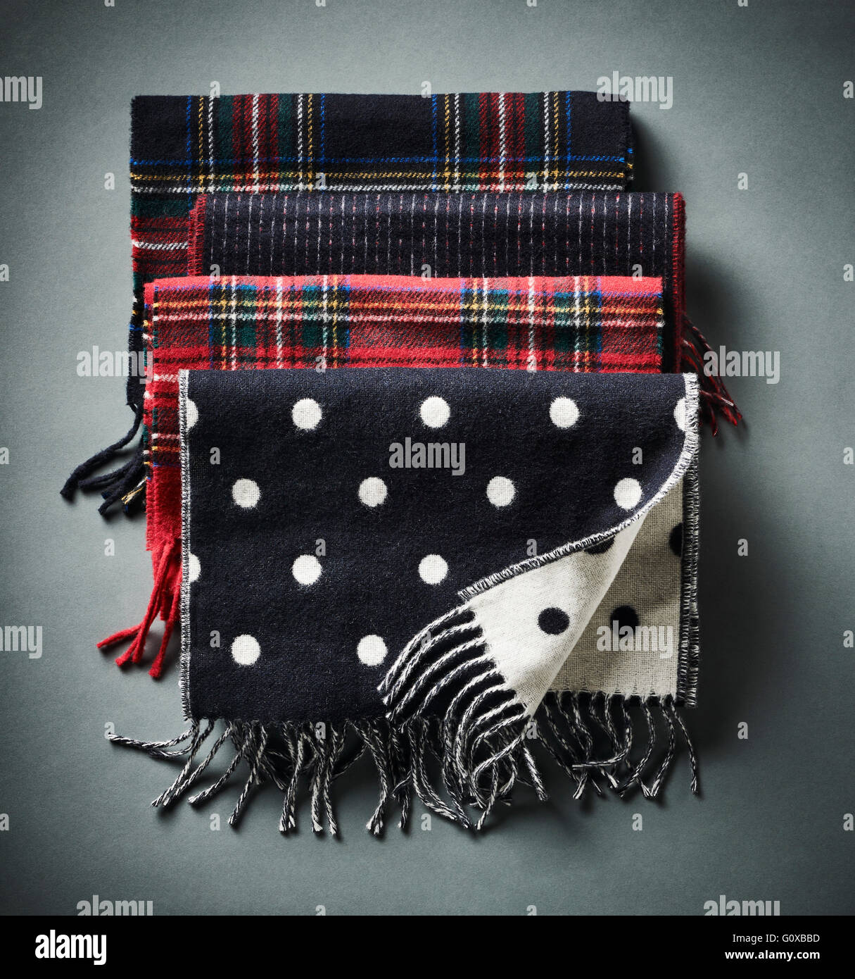 Four scarves on grey background in studio Stock Photo - Alamy