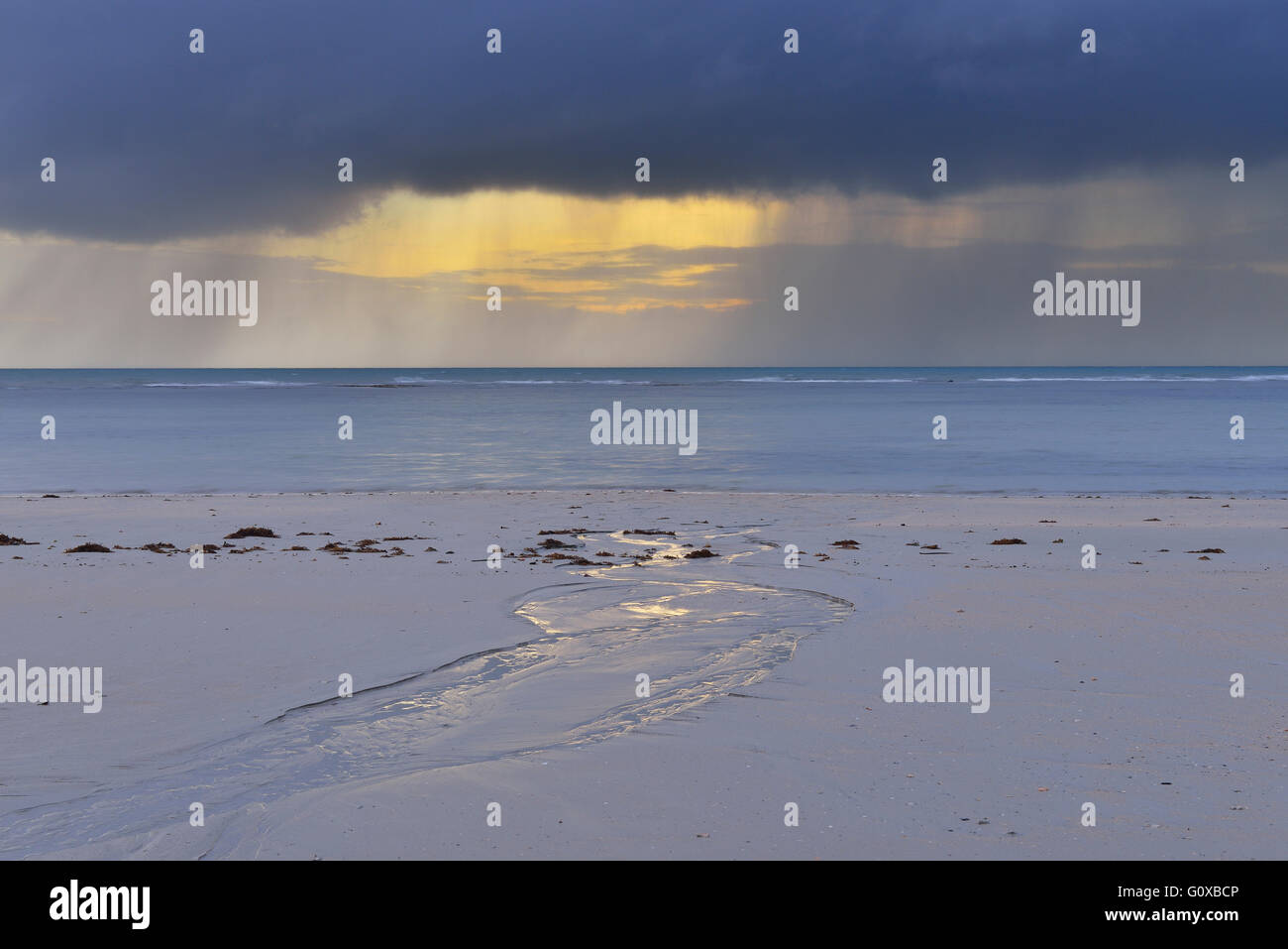 Sandy Beach with Tideway Watercourse and Storm Clouds in Morning ...