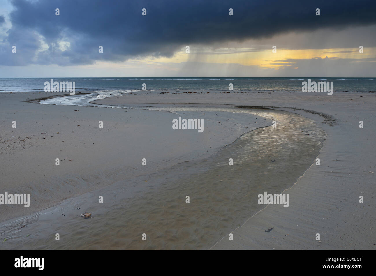 Sandy Beach with Tideway Watercourse and Storm Clouds in Morning ...