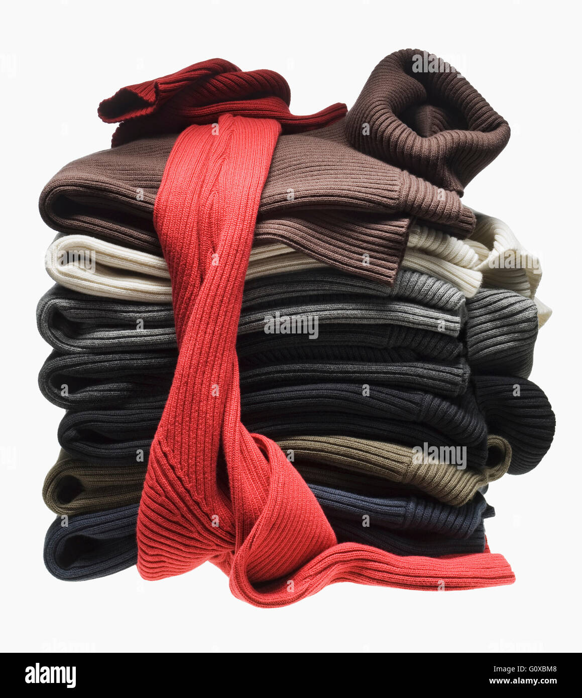 Stack of multi-coloured sweaters on white background Stock Photo - Alamy
