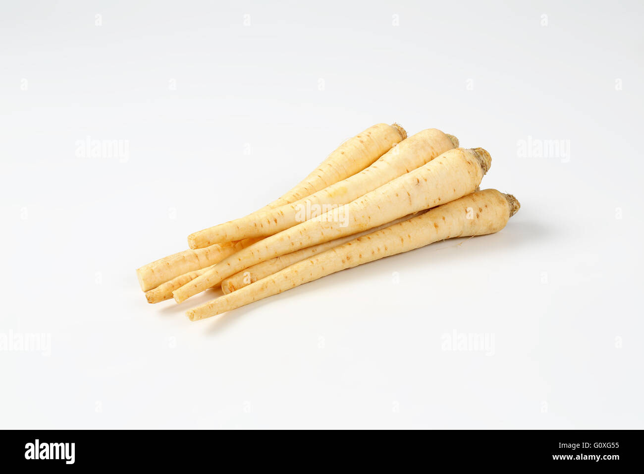 bunch of fresh root parsley on white background Stock Photo - Alamy