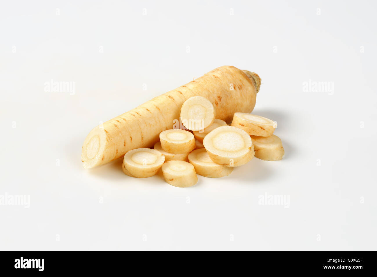 sliced root parsley on white background Stock Photo - Alamy