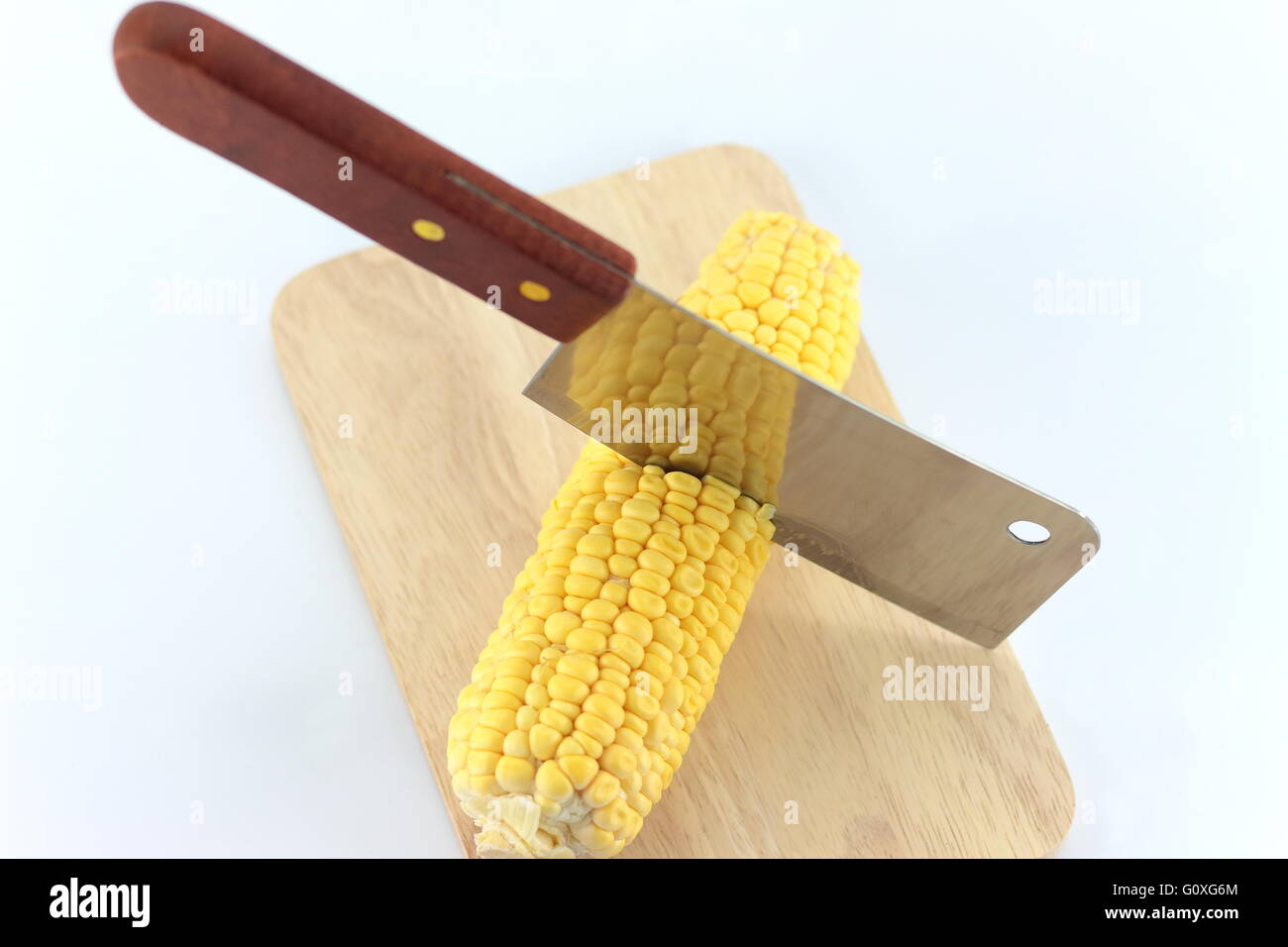 corn : split on the Chopping Block and Kitchen knife Stock Photo - Alamy
