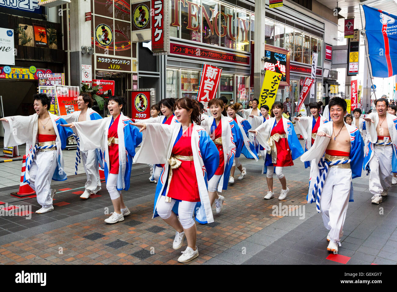 Japanese Yosakoi dance festival. Mixed-sex dance team, wearing blue and ...