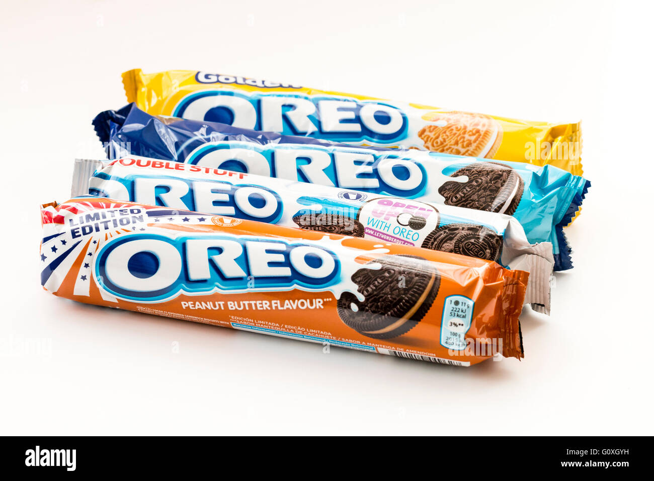 Food. Four packets of different flavoured Oreo biscuits next to each ...
