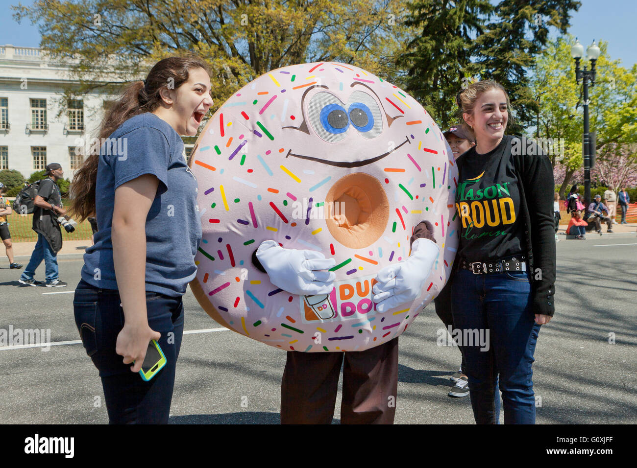 Dunkin Donuts promotion character taking pictures with fans at an ...
