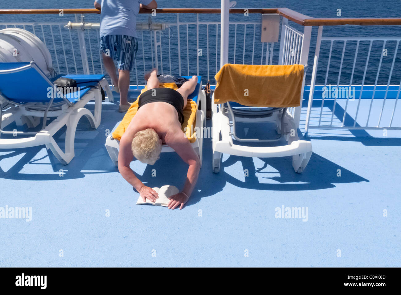People sunbathing on the deck of a cruise ship Stock Photo - Alamy
