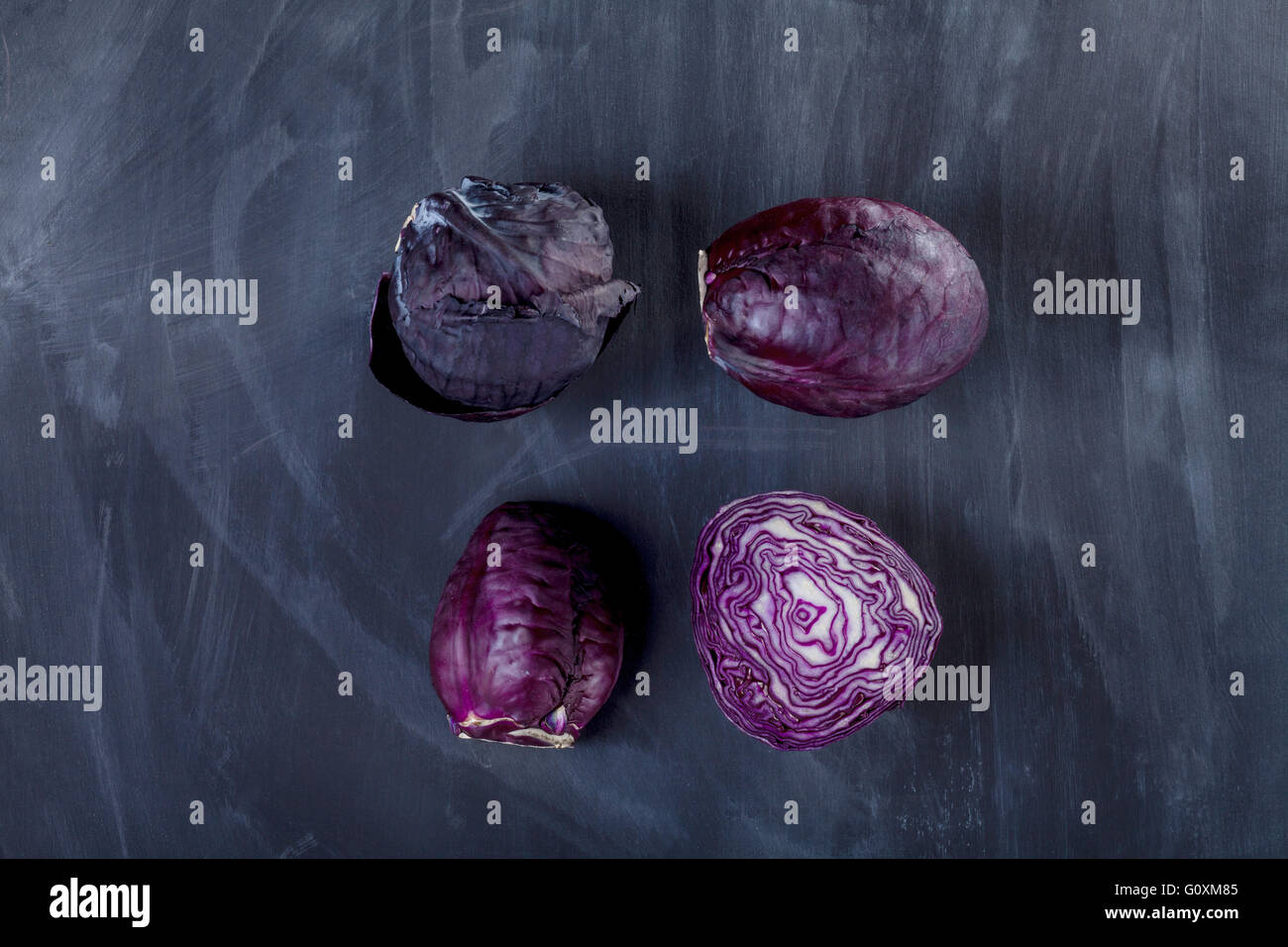 Four red cabbages on the blackboard from the top Stock Photo - Alamy